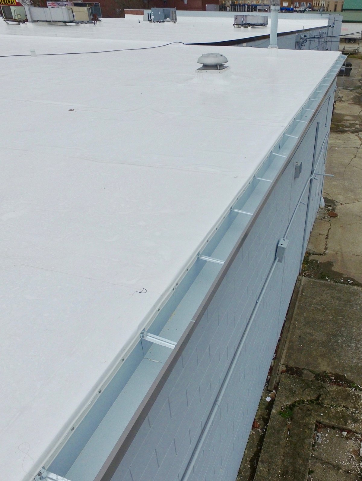 Commercial Flat Roof & Gutter Repair North Vernon Plaza